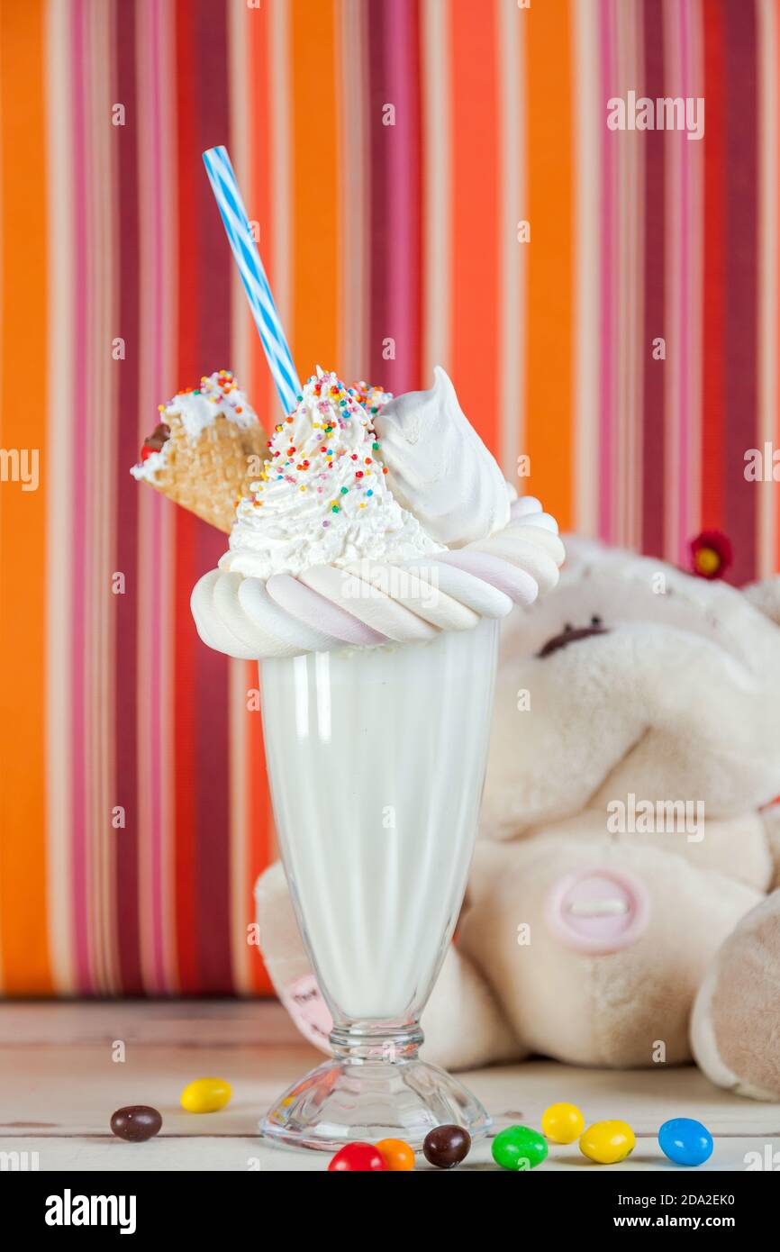 Bright children's milkshake in a colorful interior Stock Photo - Alamy