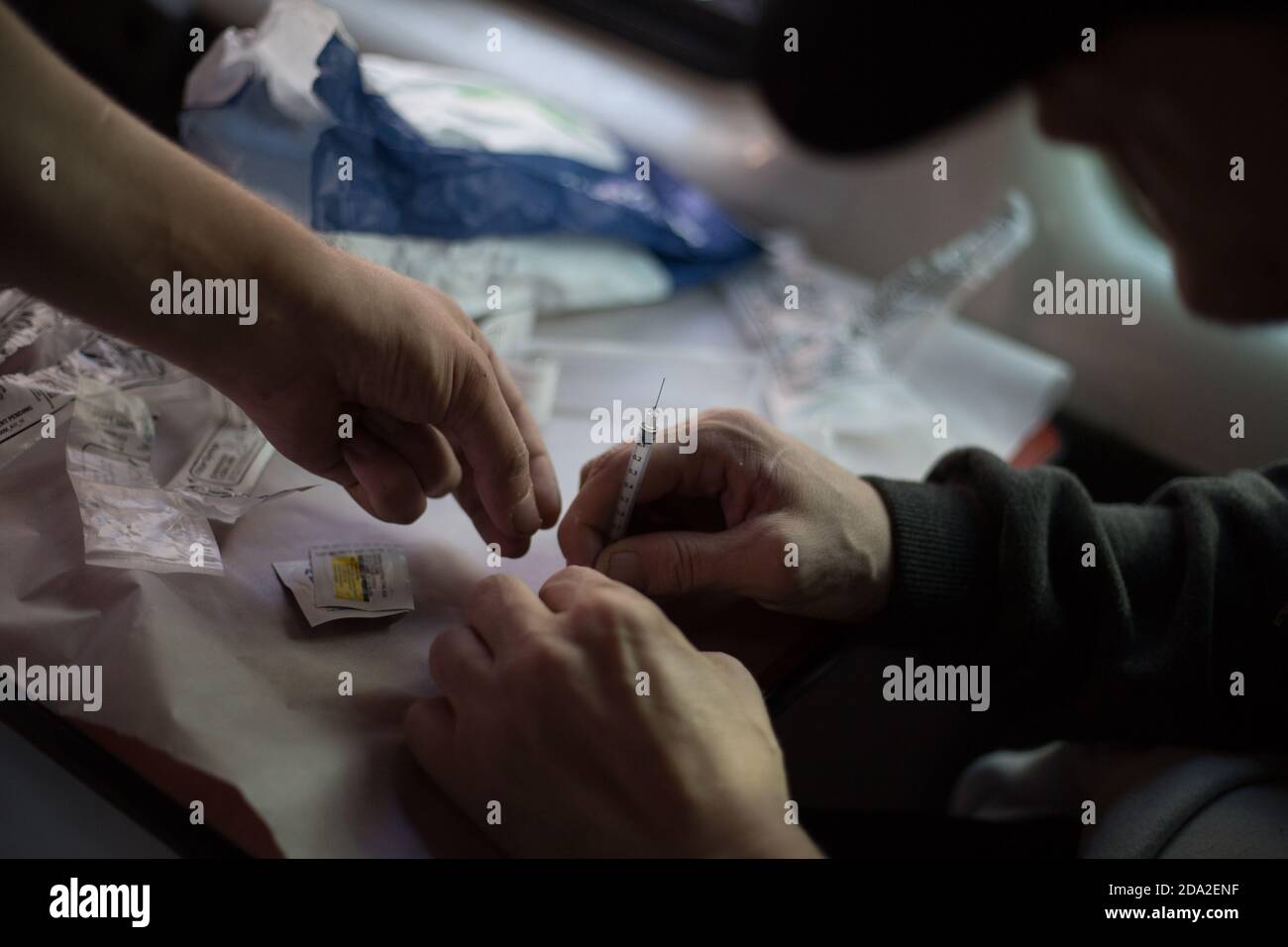 Drug addicts prepare and inject their heroin and drugs, inside the Safe ...