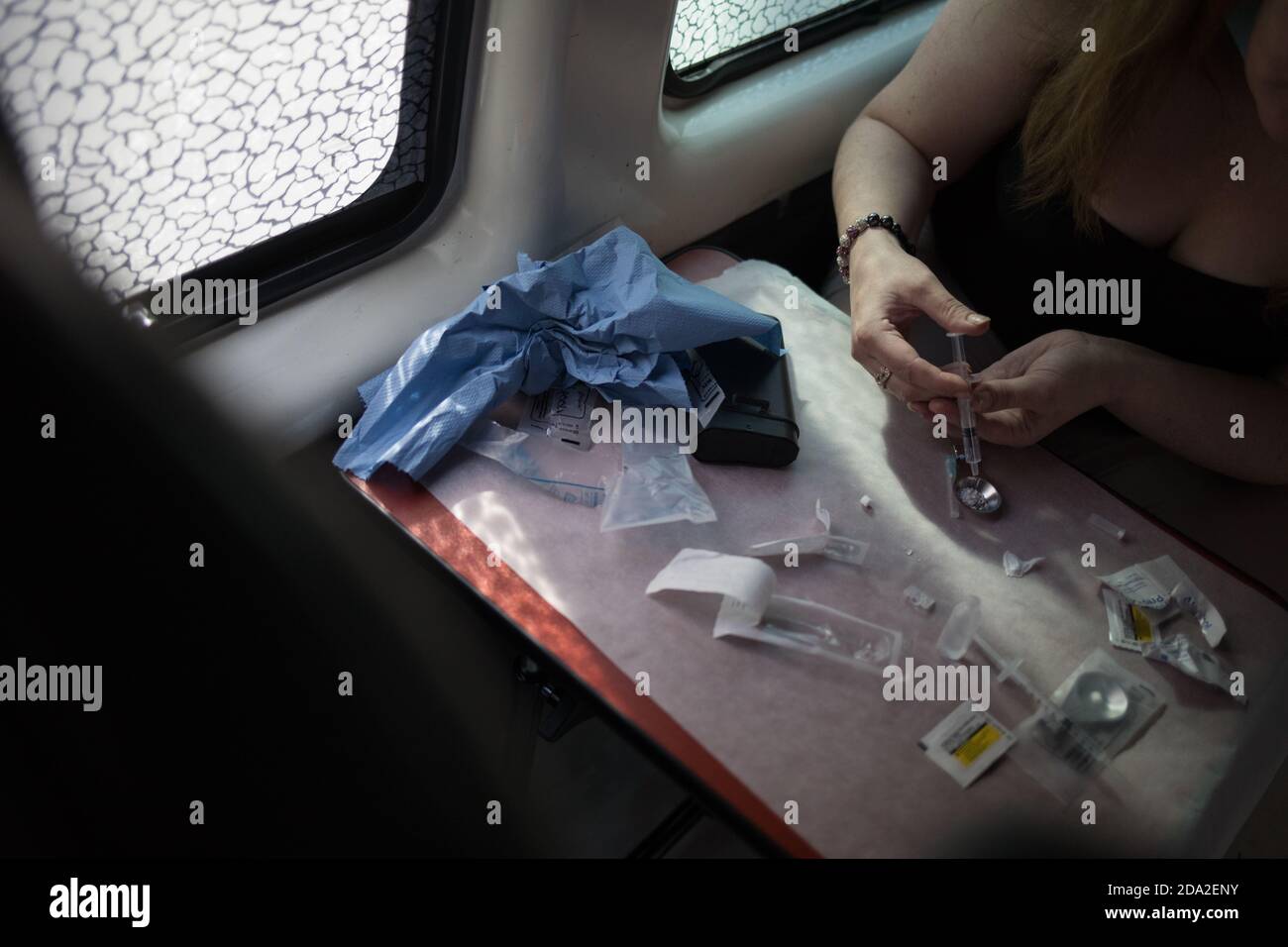 Drug addicts prepare and inject their heroin and drugs, inside the Safe ...