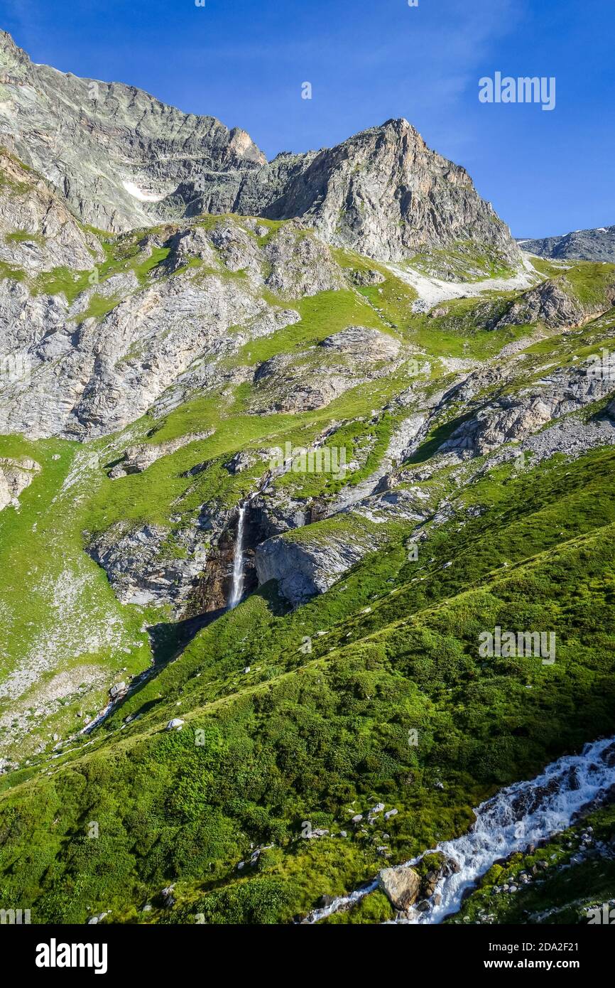 Waterfall in Vanoise national Park alpine valley, Savoie, French alps ...