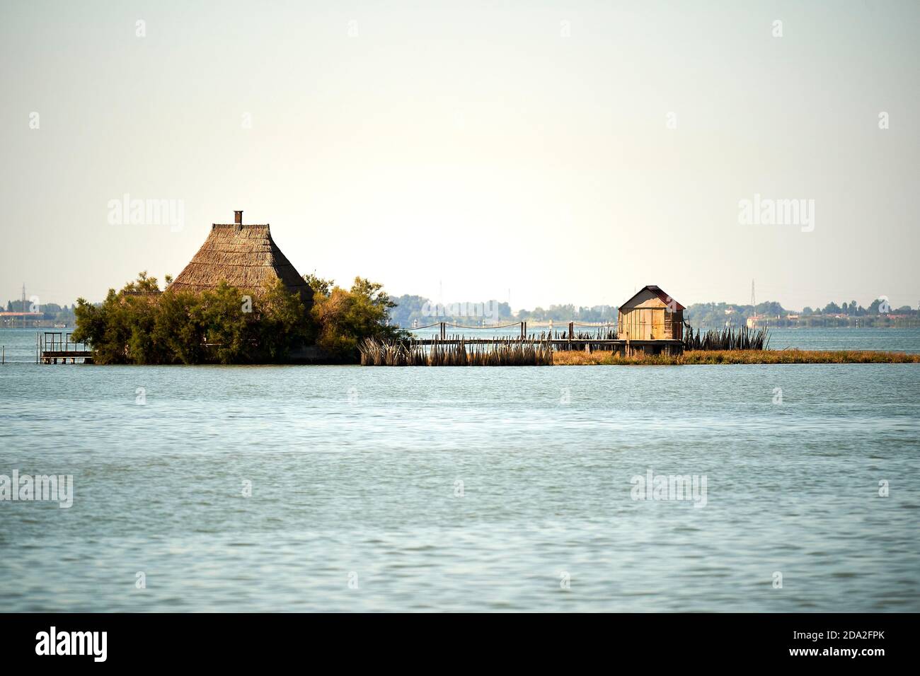 Casoni. Typical buildings of the Lagoon of Marano, Italy Stock Photo ...