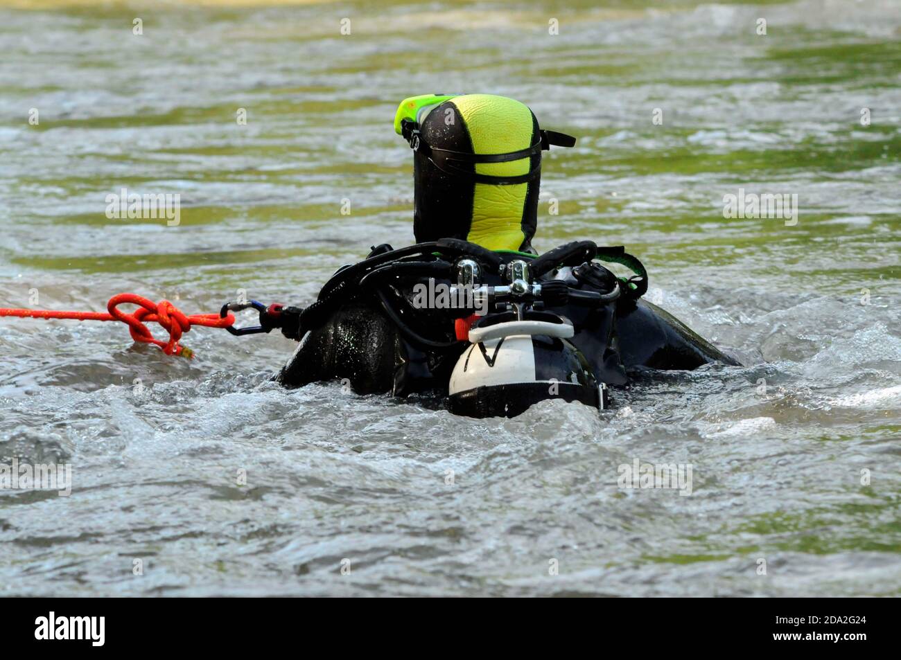 fire department rescue diver with safety rope and oxygen cylinder in ...