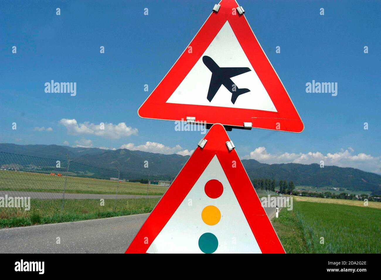 attention air traffic sign, red triangle and airplane pictogram, blue ...