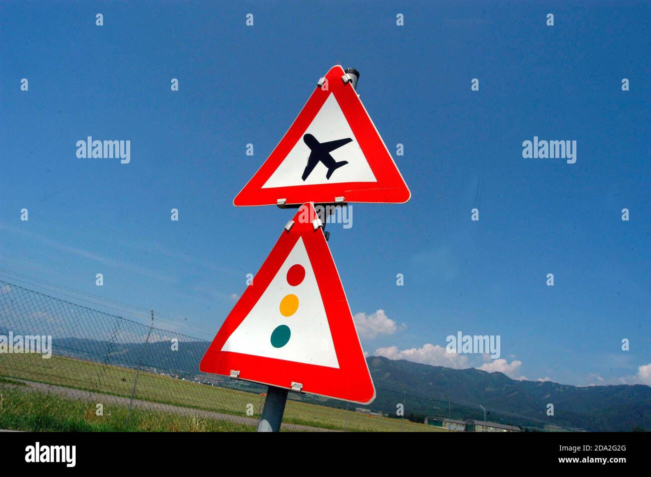 attention air traffic sign, red triangle and airplane pictogram, blue ...