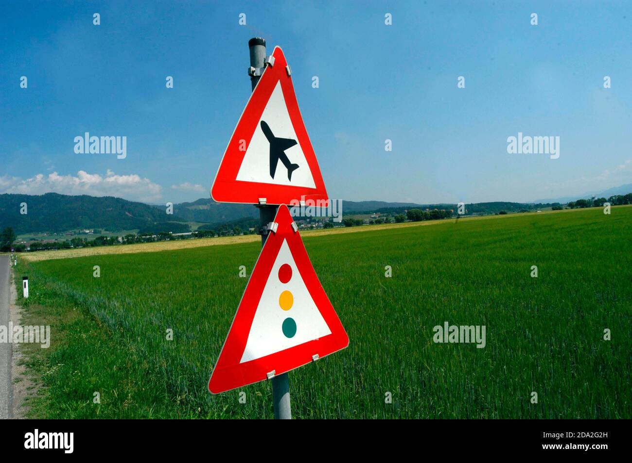 attention air traffic sign, red triangle and airplane pictogram, blue ...