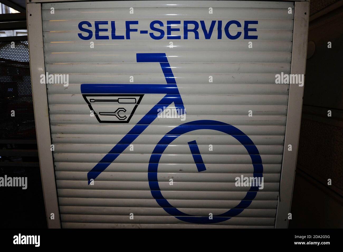 bicycle self service station sign, blue pictogram and white background ...