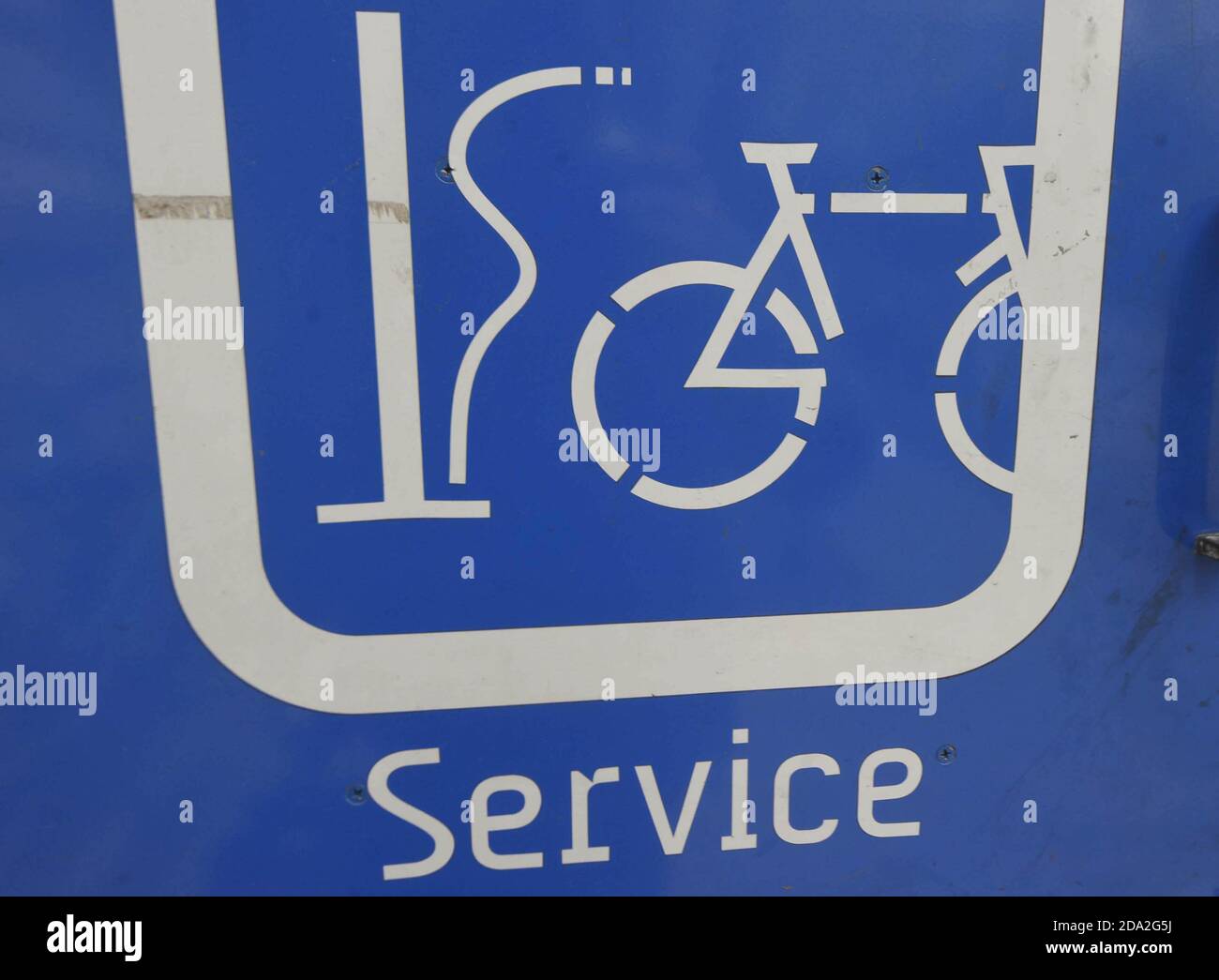 bicycle self service station sign, white pictogram and blue background ...