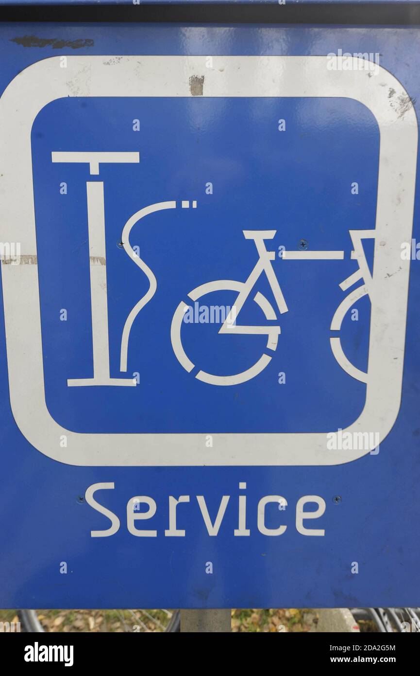 bicycle self service station sign, white pictogram and blue background ...