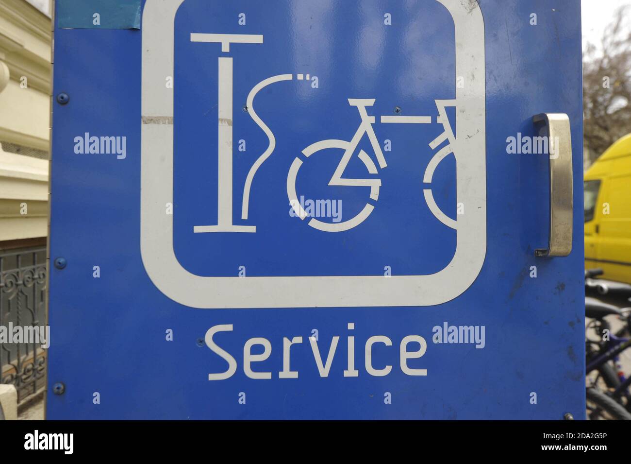 bicycle self service station sign, white pictogram and blue background ...