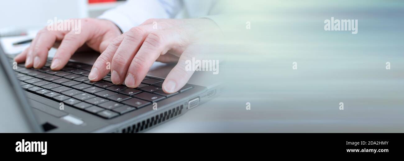 Businessman typing on his laptop, closeup; panoramic banner Stock Photo ...