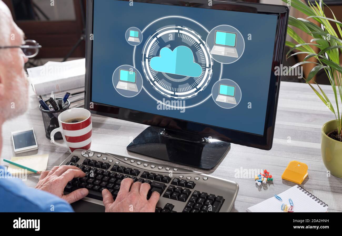 Man using a computer with cloud computing concept on the screen Stock ...