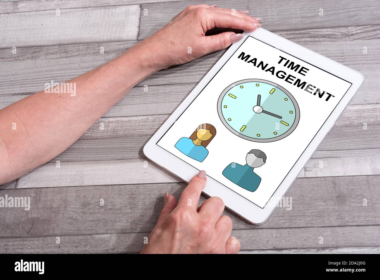Time management concept shown on a tablet used by a woman Stock Photo ...