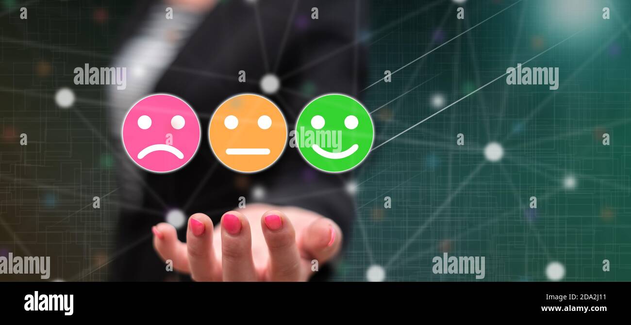 Customer satisfaction concept above the hand of a woman in background ...