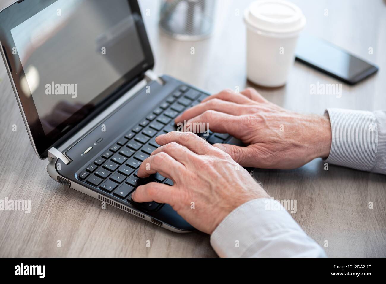Male hands typing on laptop keyboard Stock Photo - Alamy