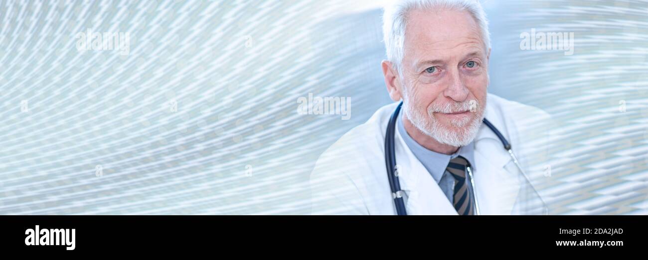Portrait of male senior doctor looking the camera; panoramic banner ...