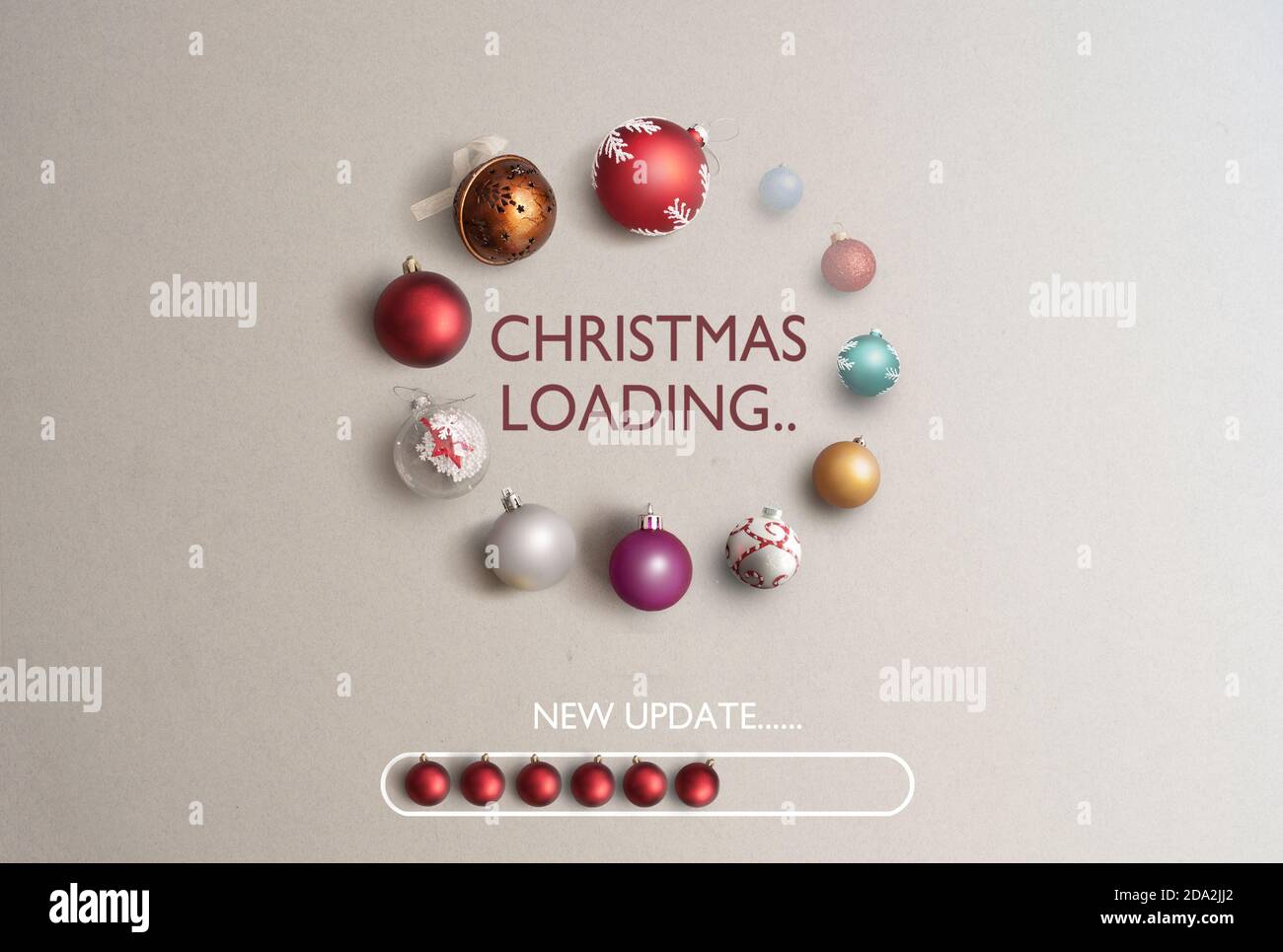 Baubles in the shape of a page loading icon with christmas loading ...