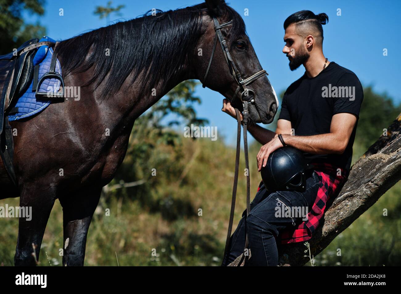 Arab tall beard man wear in black with arabian horse Stock Photo - Alamy