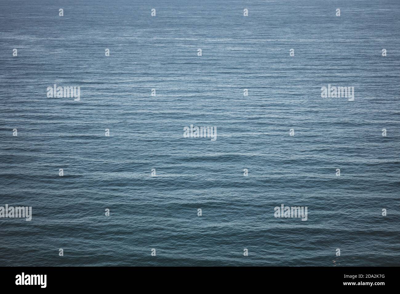 View of a calm dark blue ocean Stock Photo - Alamy