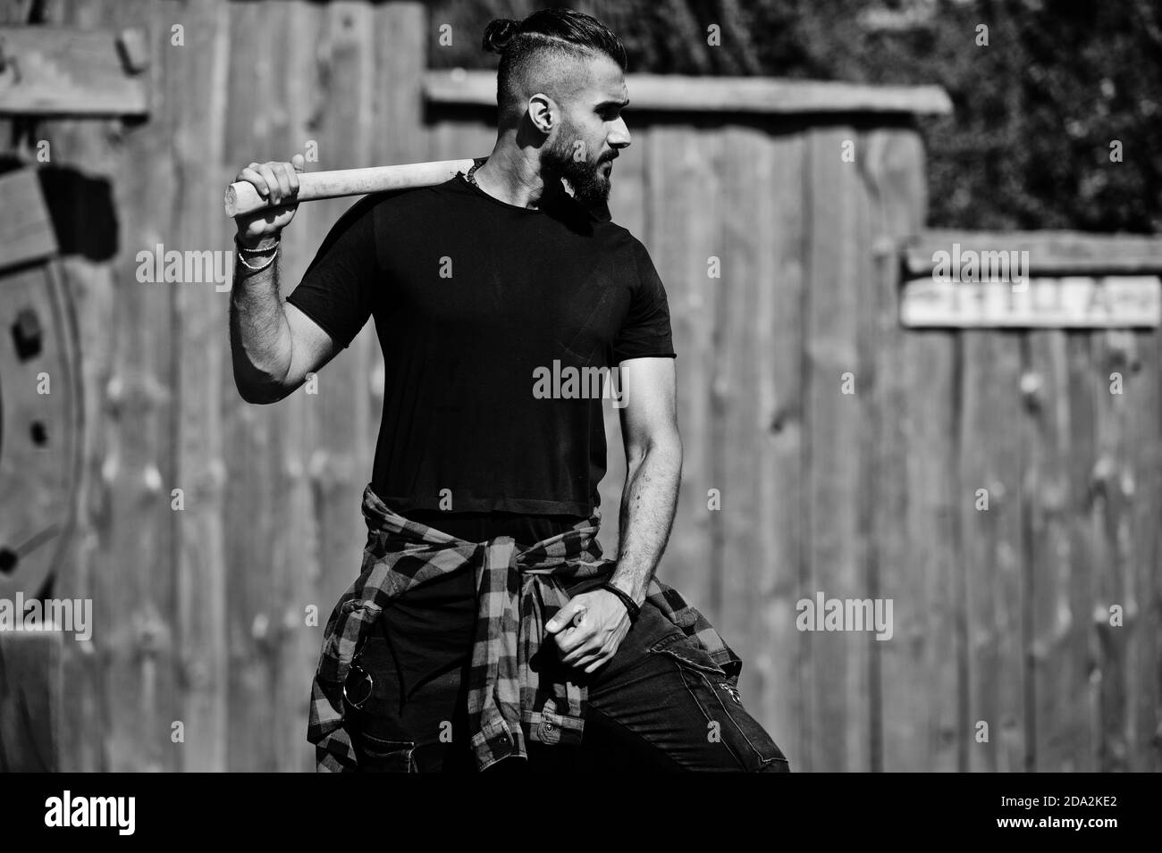 Portrait handsome bearded man holding Black and White Stock Photos ...