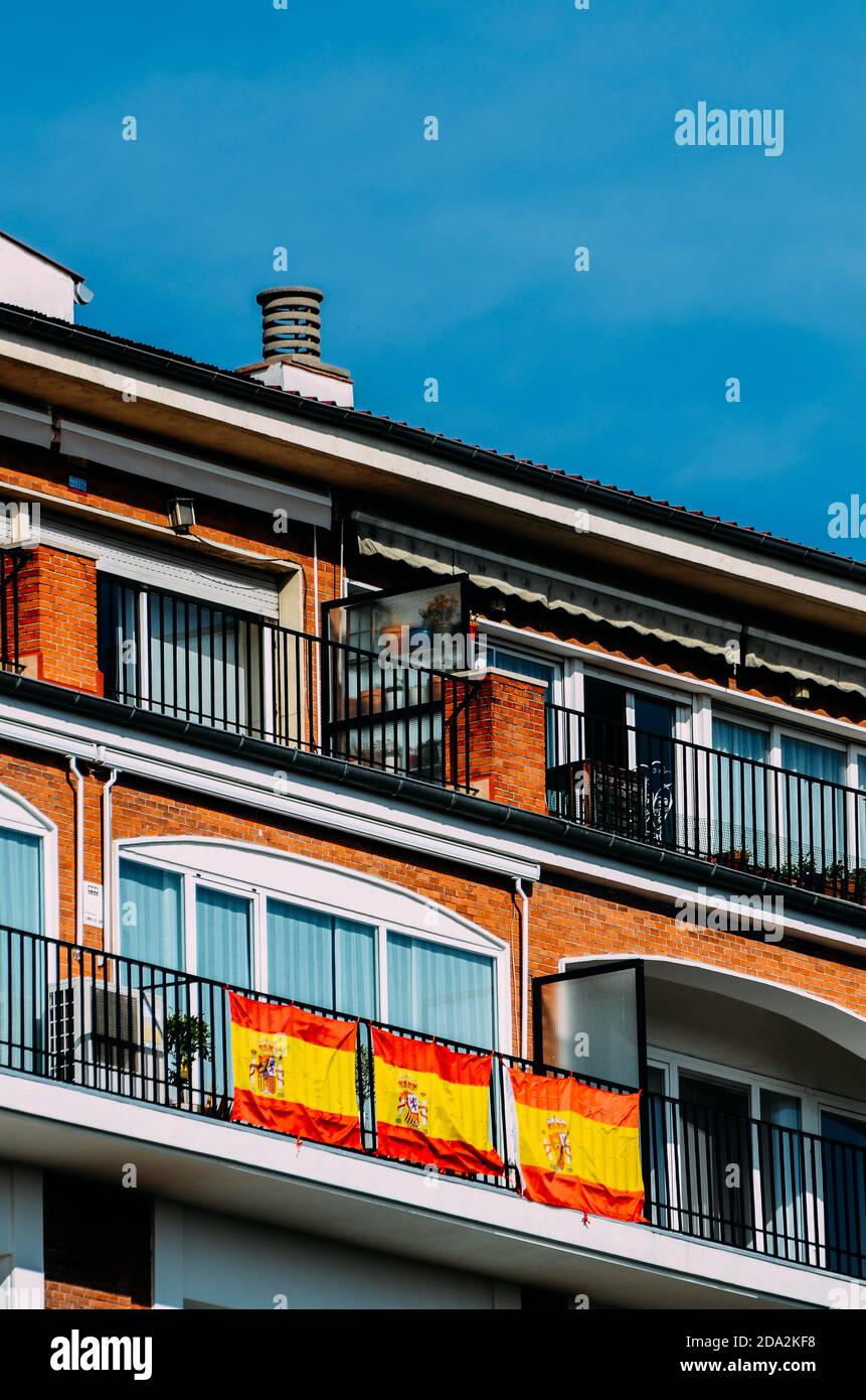 Vertical low angle shot of Spanish flags on a building balcony Stock ...