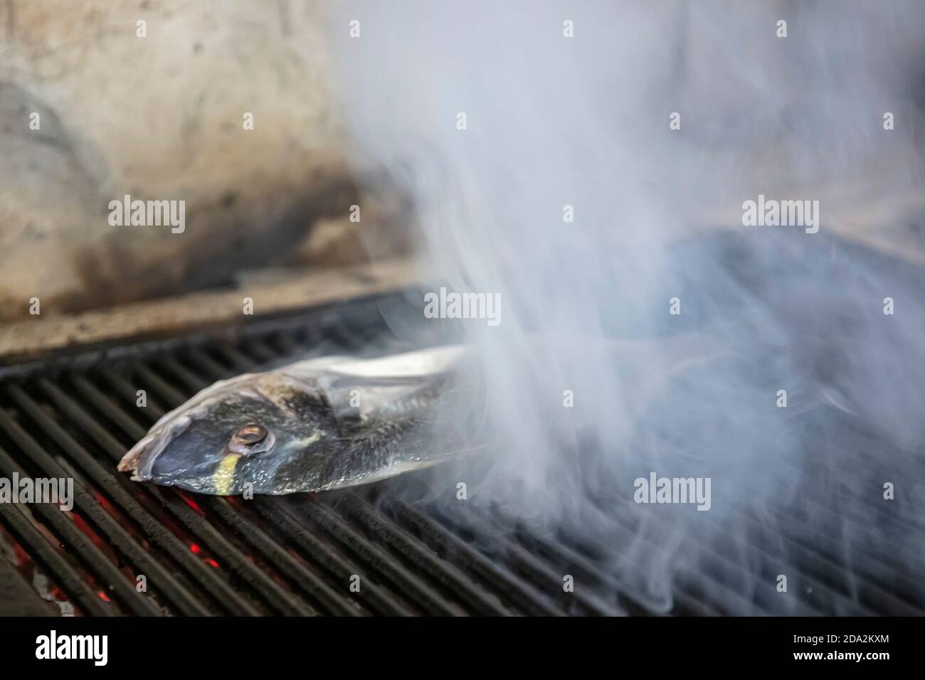 Sea bream fish on the grill. Grilled fish dish sea bream restaurant ...