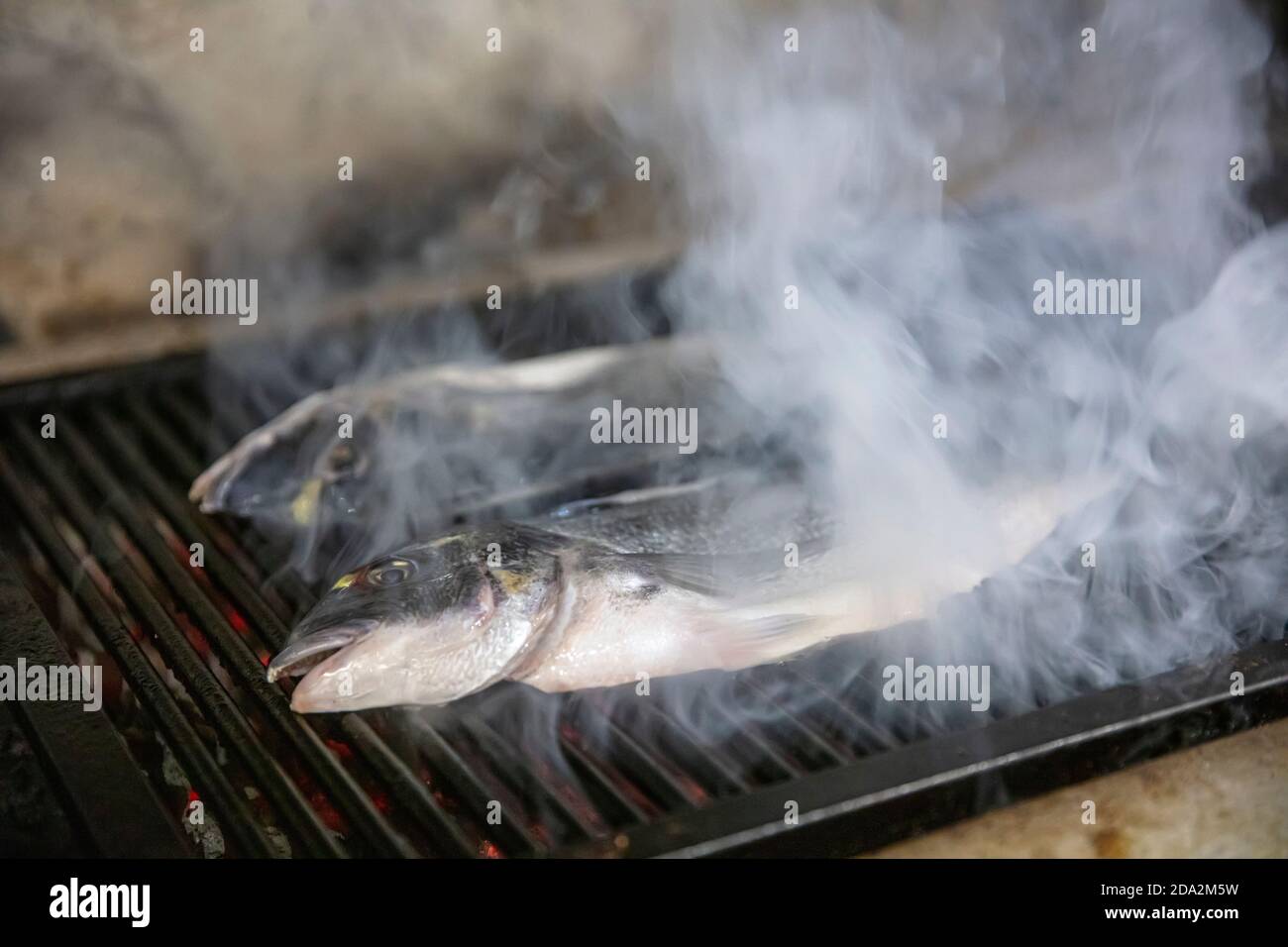 Sea bream fish on the grill. Grilled fish dish sea bream restaurant ...