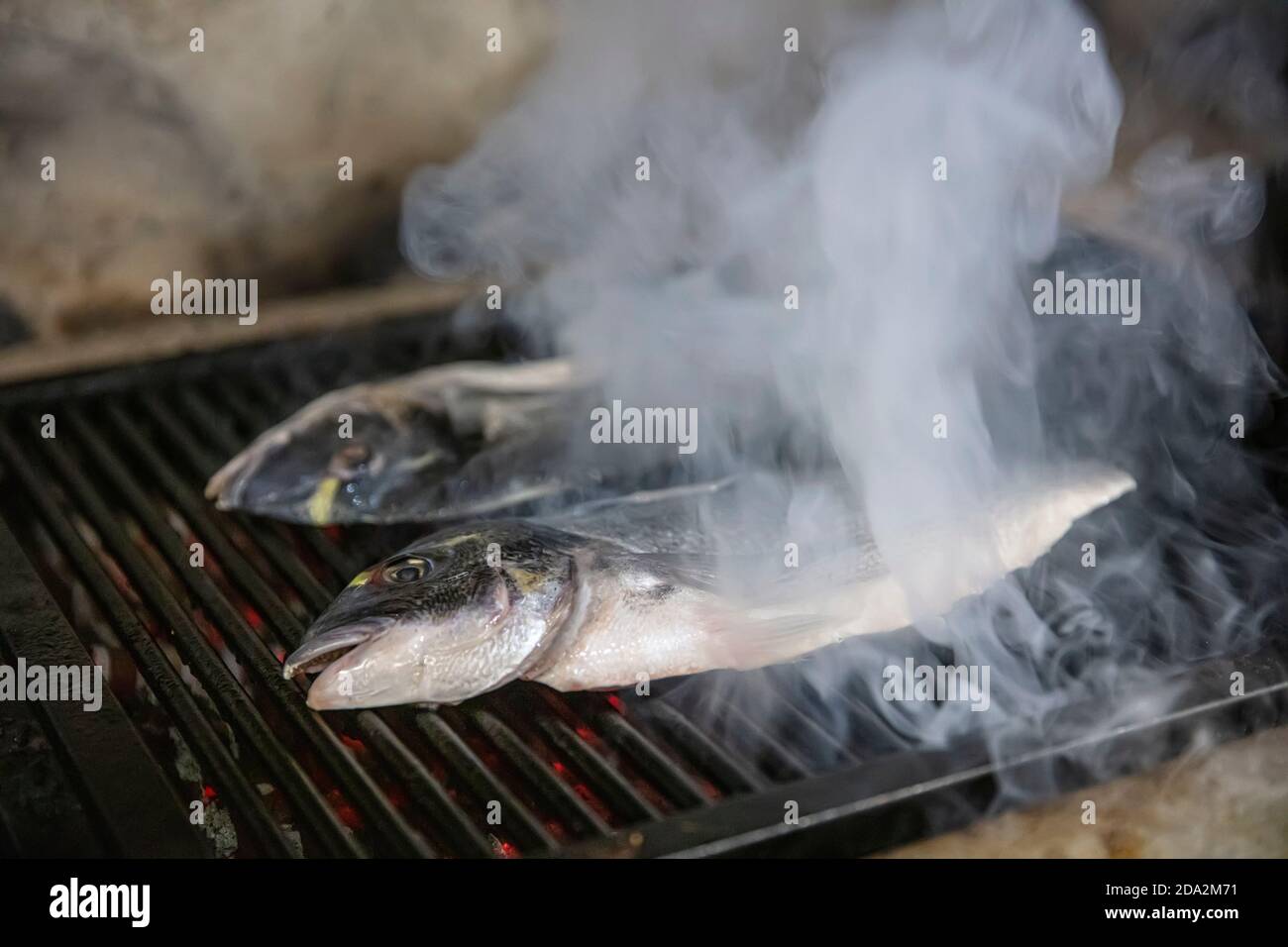 Sea bream fish on the grill. Grilled fish dish sea bream restaurant ...