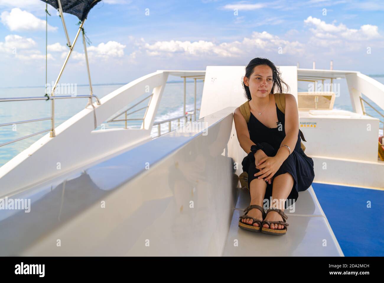 Brunette Beautiful Young Girl Sitting On A Sailing Boat With An Ocean