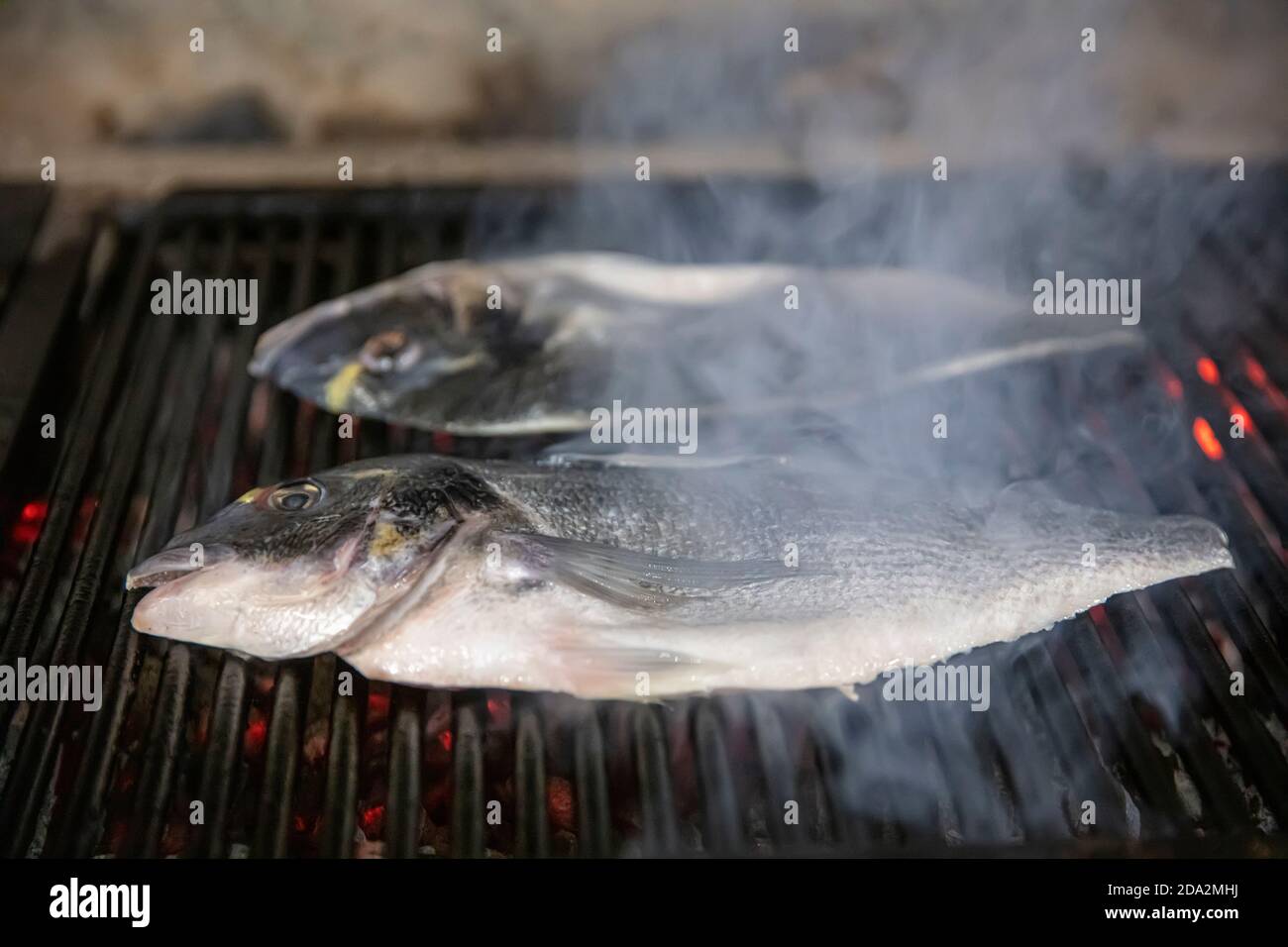 Sea bream fish on the grill. Grilled fish dish sea bream restaurant ...