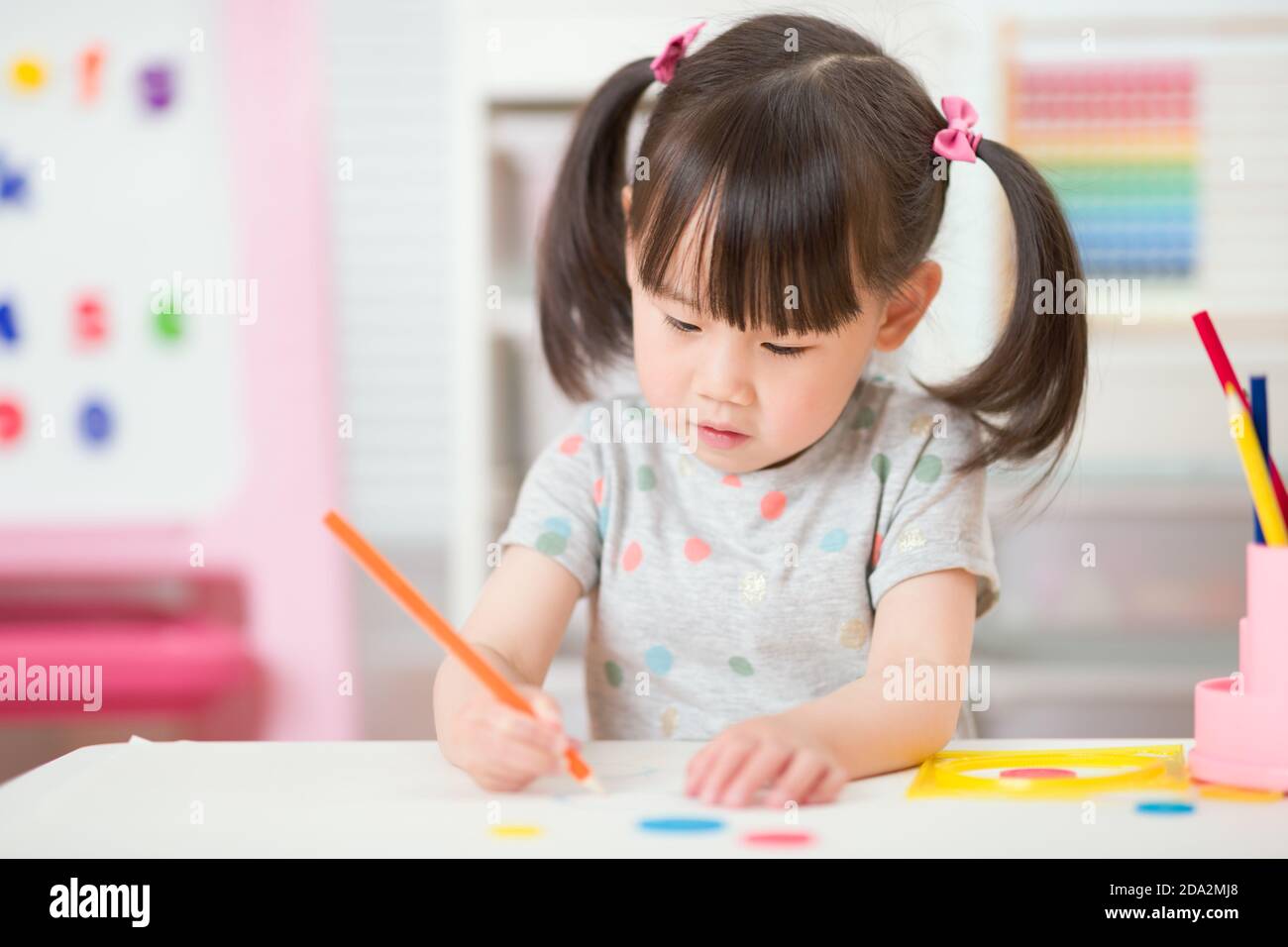 young girl practice drawing different shapes for homeschooling Stock ...