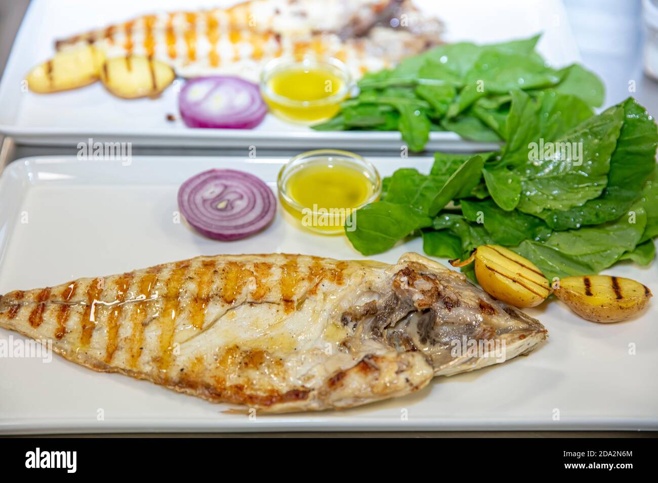 Sea bream fish on the grill. Grilled fish dish sea bream restaurant ...
