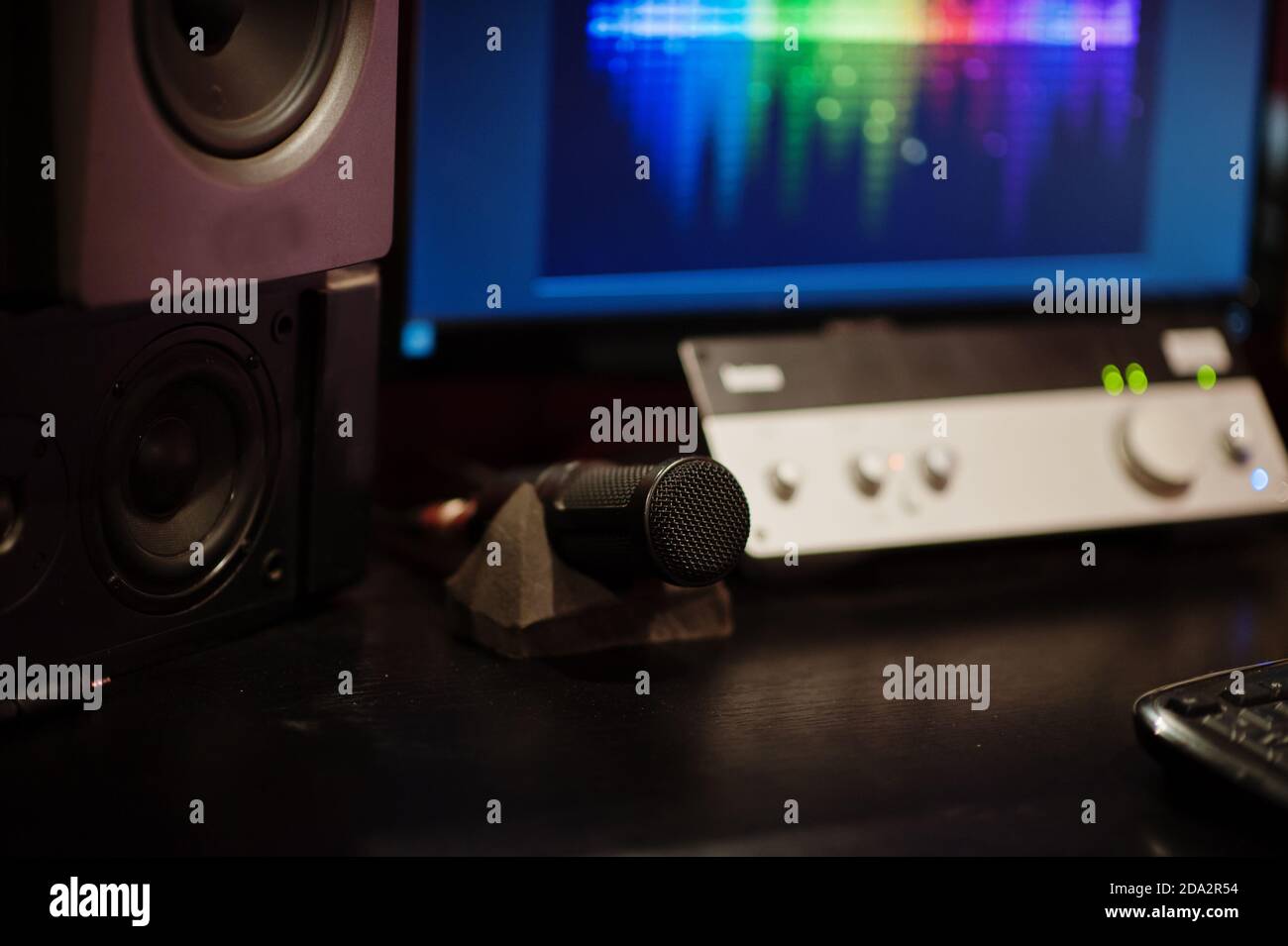 Monitors with microphone in record music studio Stock Photo - Alamy