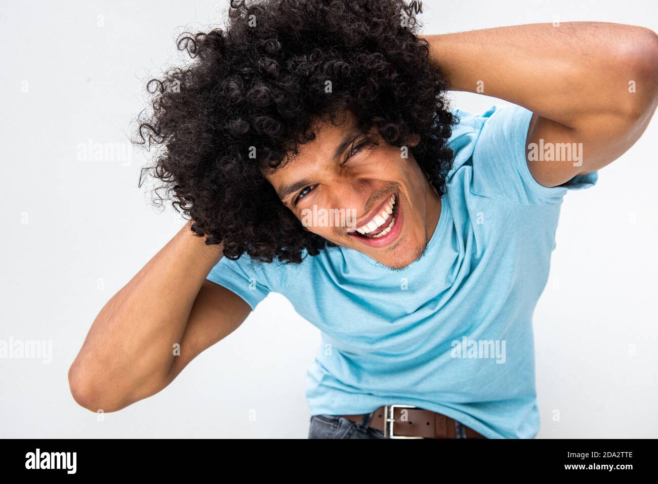 Close up portrait North African man laughing with hands behind head ...