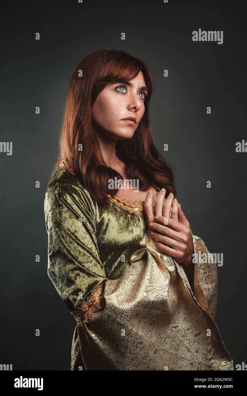 Beautiful medieval woman with eyes to the sky. Holiness and prayer ...