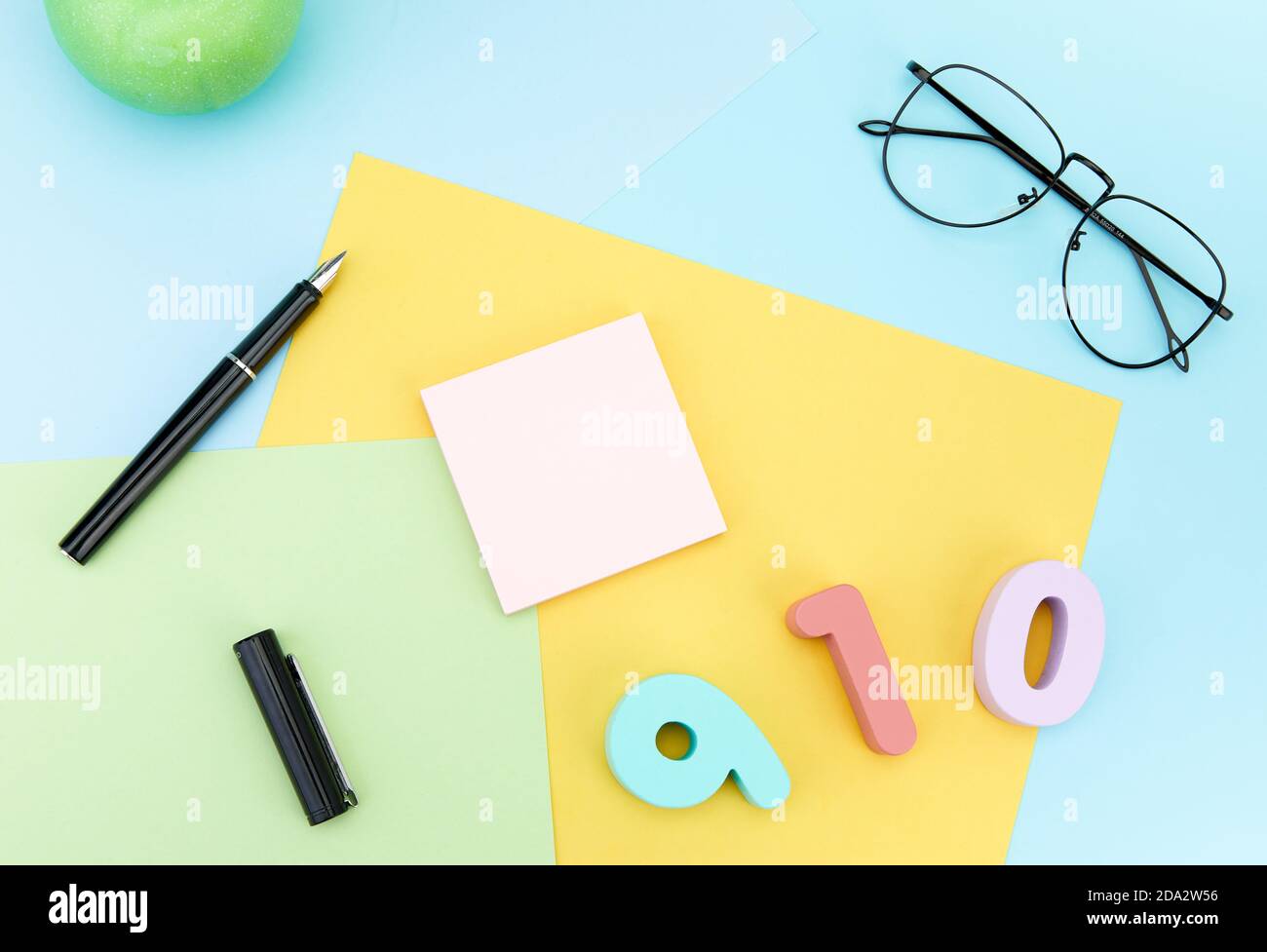 Top view of 910 number with ballpen, piece of paper, and eyeglass ...