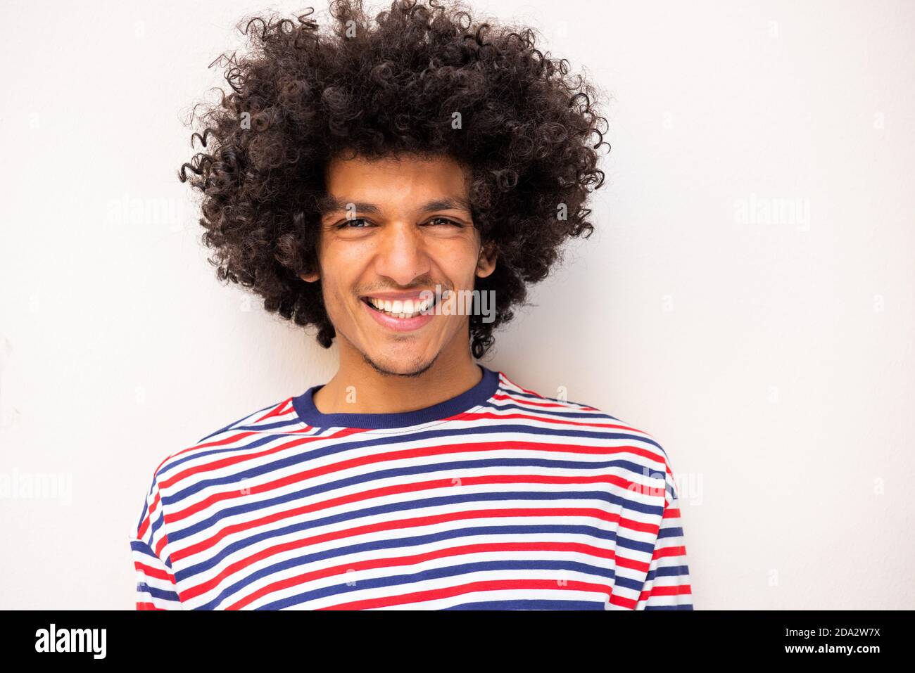 Close up front portrait handsome young arabic man with afro hair ...