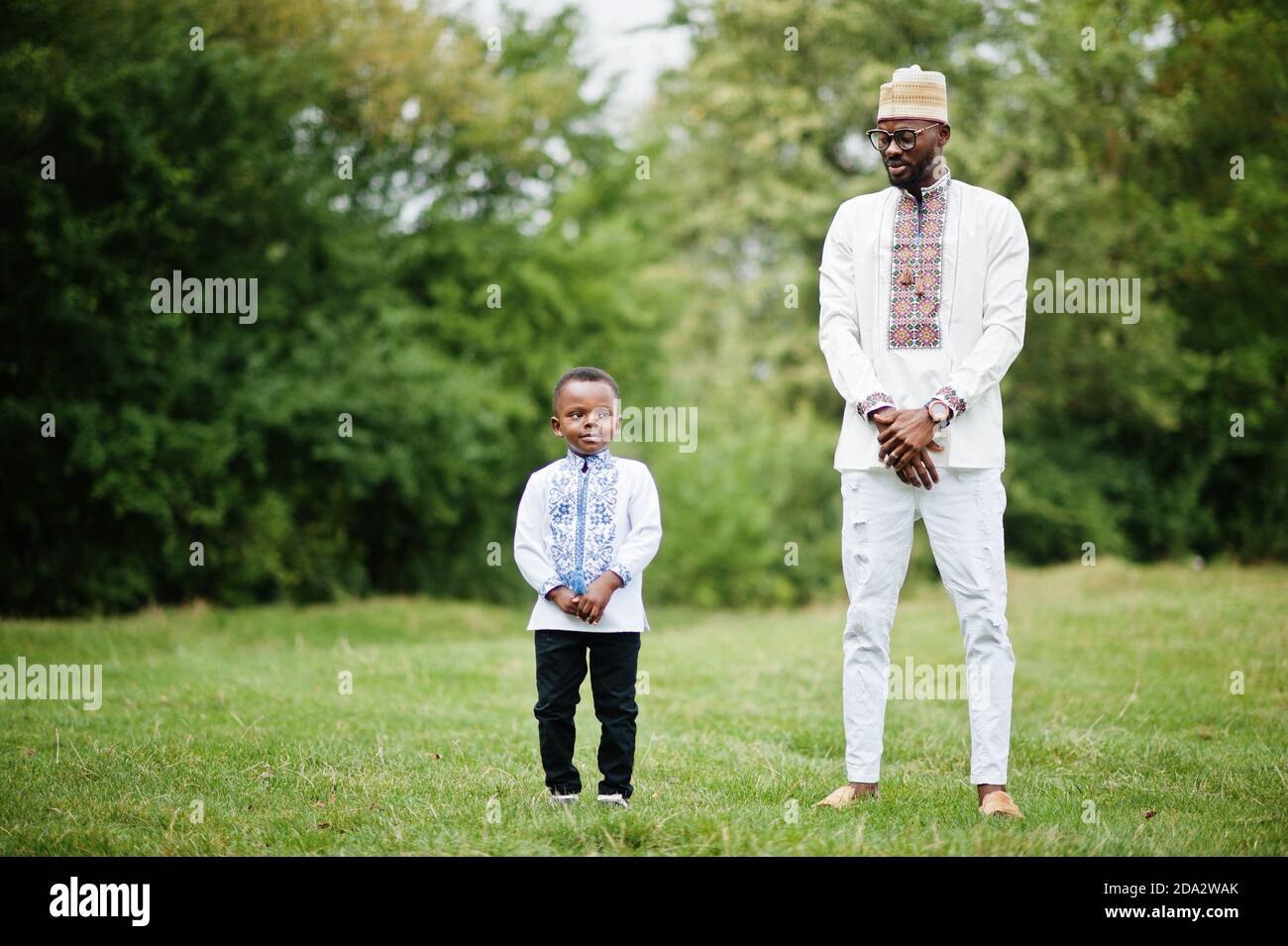 African father with son in traditional clothes at park Stock Photo - Alamy