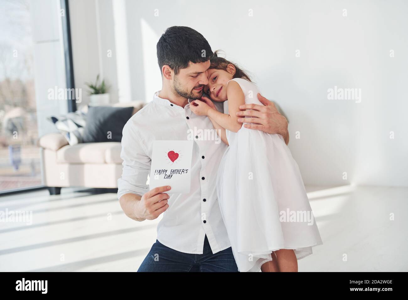 Happy father's day. Daughter makes surprise for dad by giving postcard ...