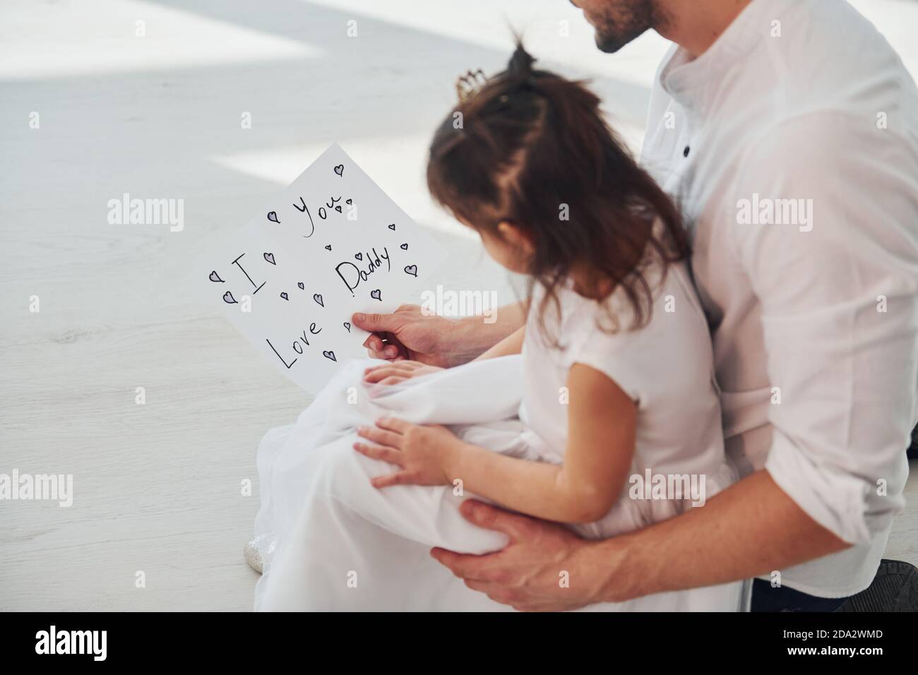 Happy father's day. Daughter makes surprise for dad by giving postcard ...