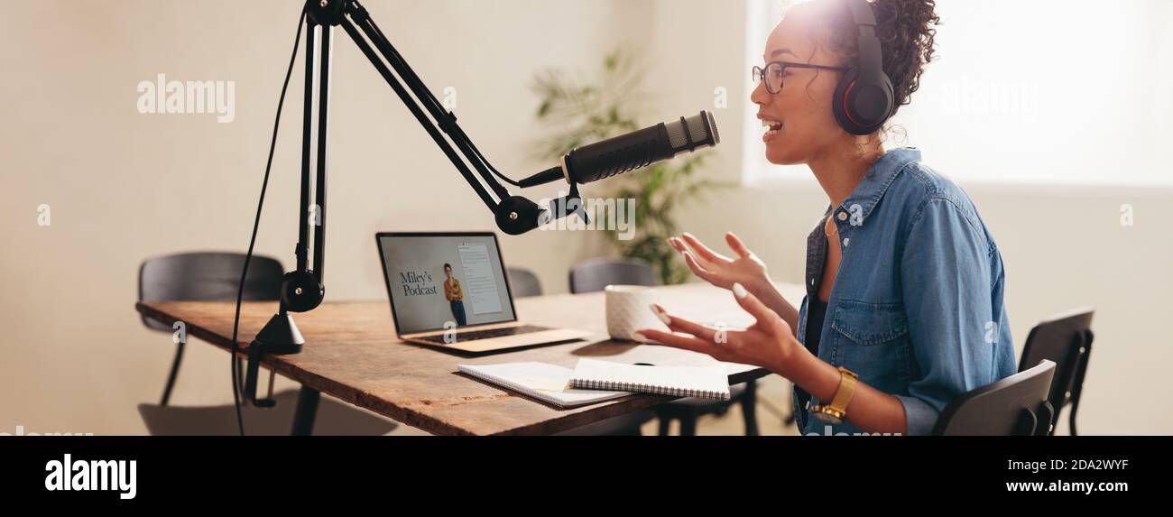 Woman talking into microphone hi-res stock photography and images - Alamy