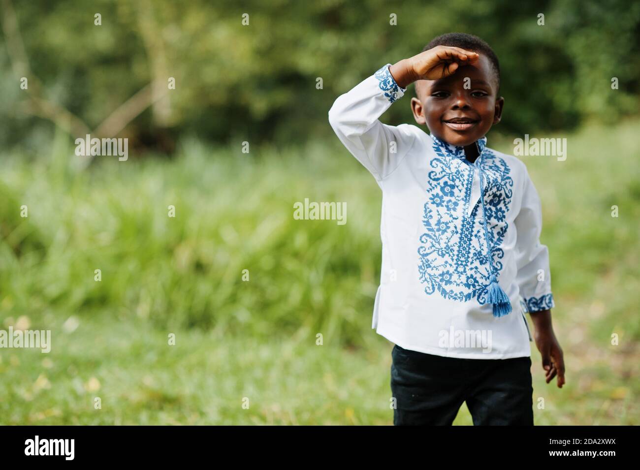 Portrait of african boy kid in traditional clothes at park Stock Photo ...