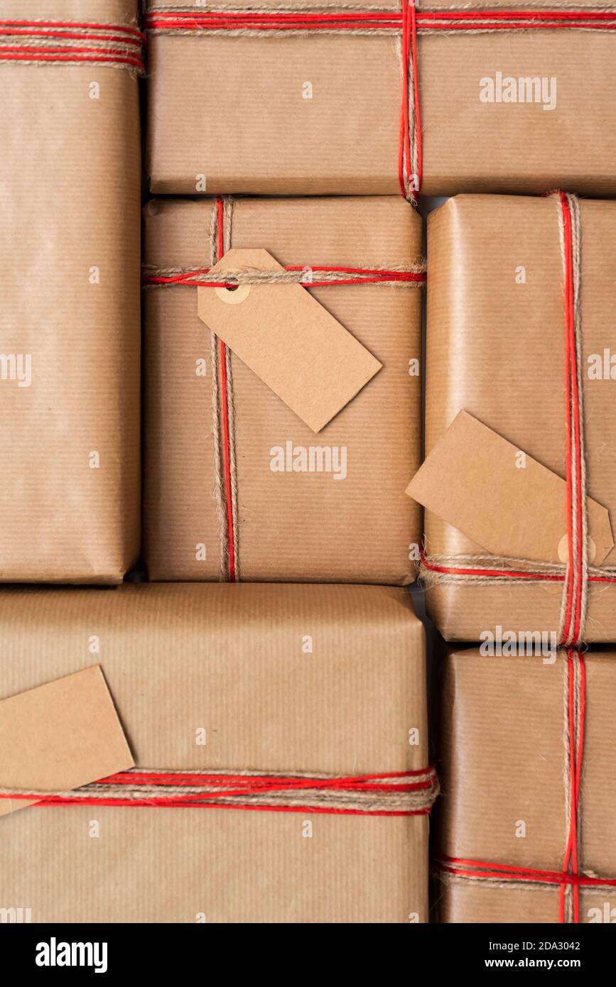 Stack of craft gifts wrapped in recycled paper Stock Photo - Alamy