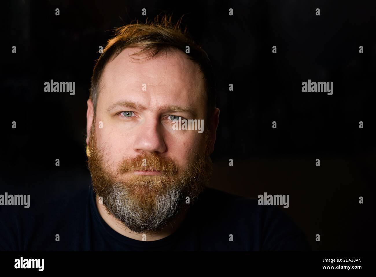 Adult european man portrait on black background Stock Photo - Alamy
