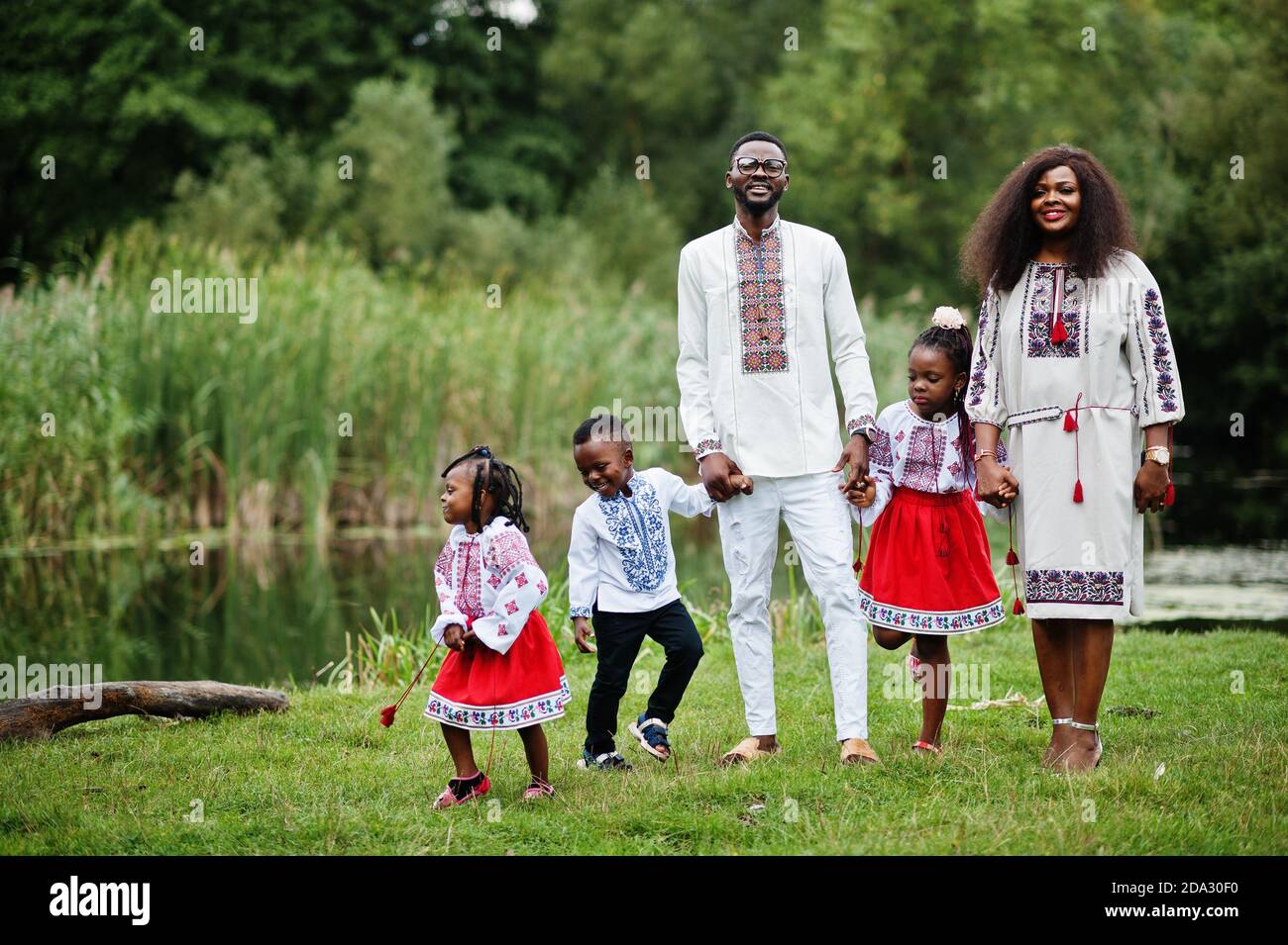 African family in traditional clothes at park Stock Photo - Alamy