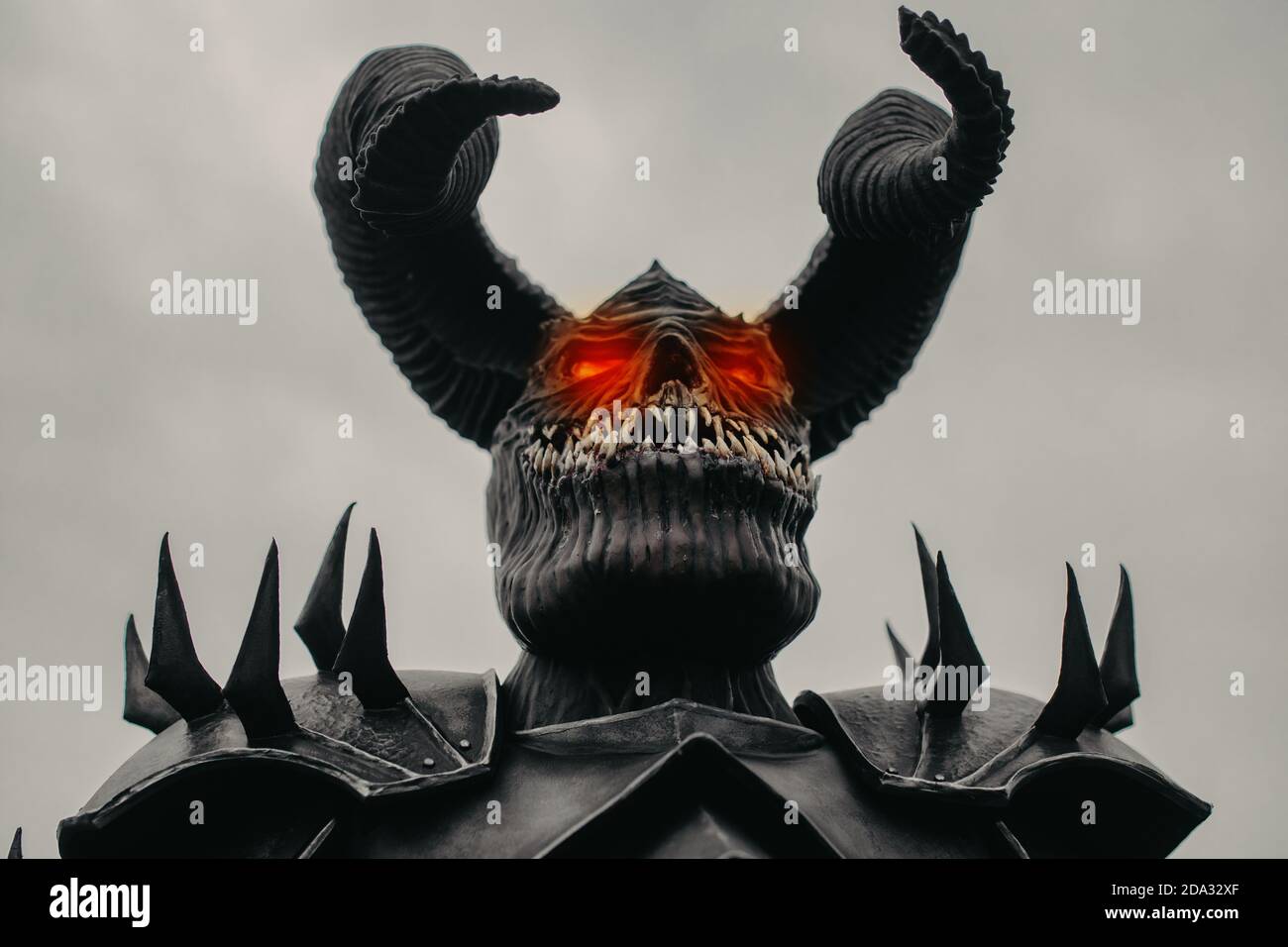 Portrait of a mutant warrior in armor with terrible teeth, horns and ...