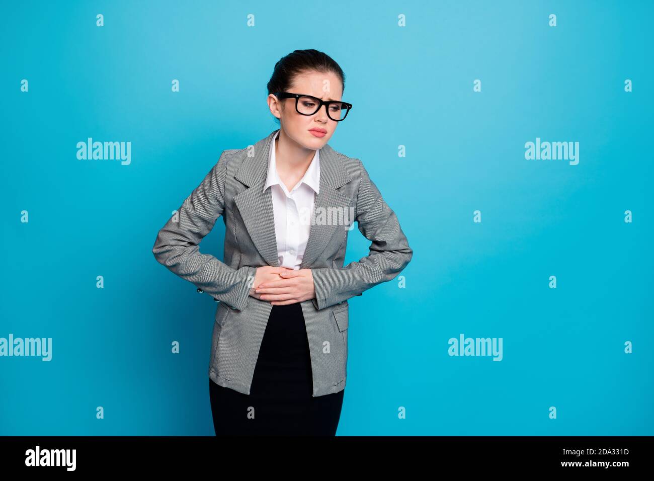 Portrait of attractive sick lady feeling bad touching belly tummy ...