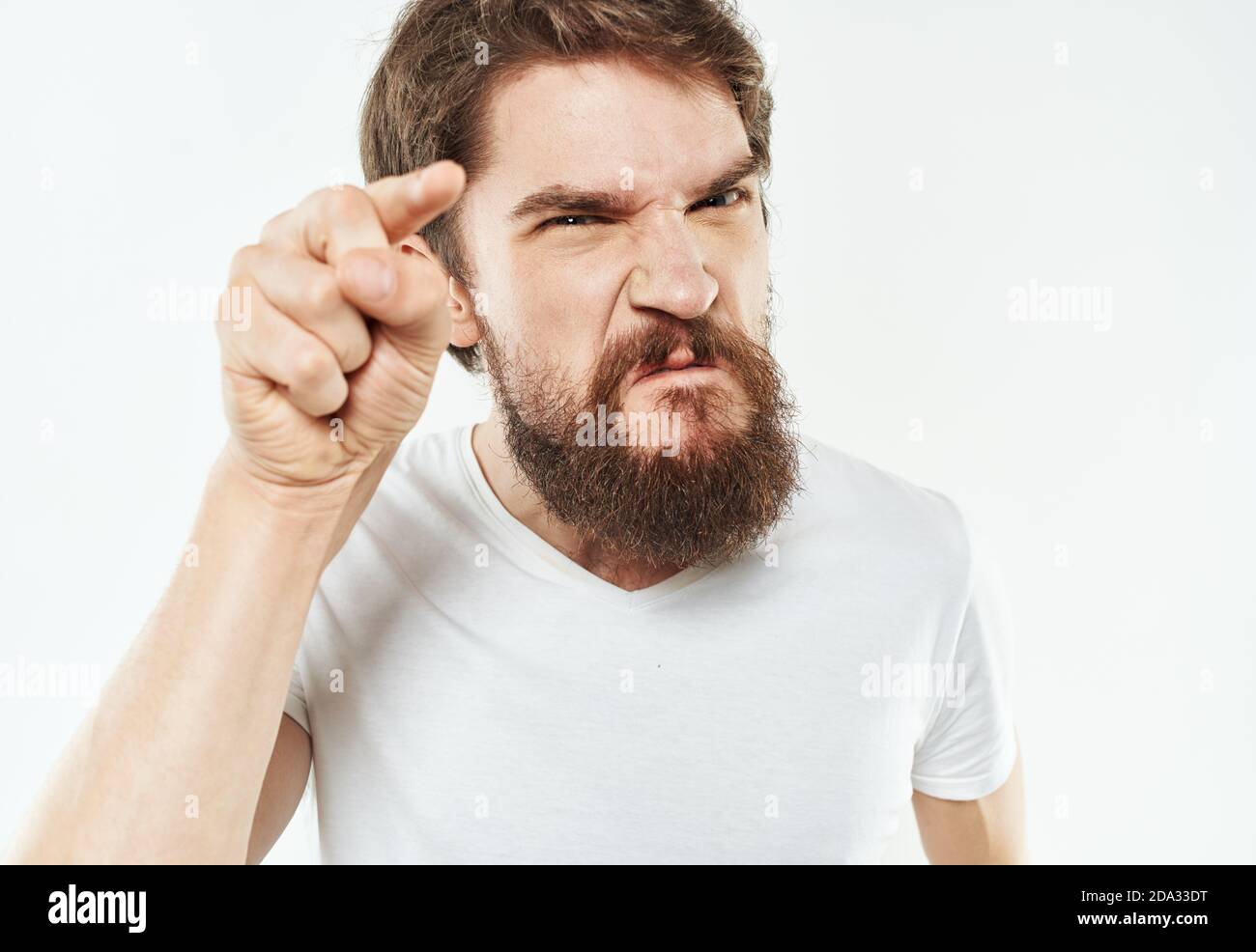 Aggressive man irritability emotions gesturing with model hands Stock ...