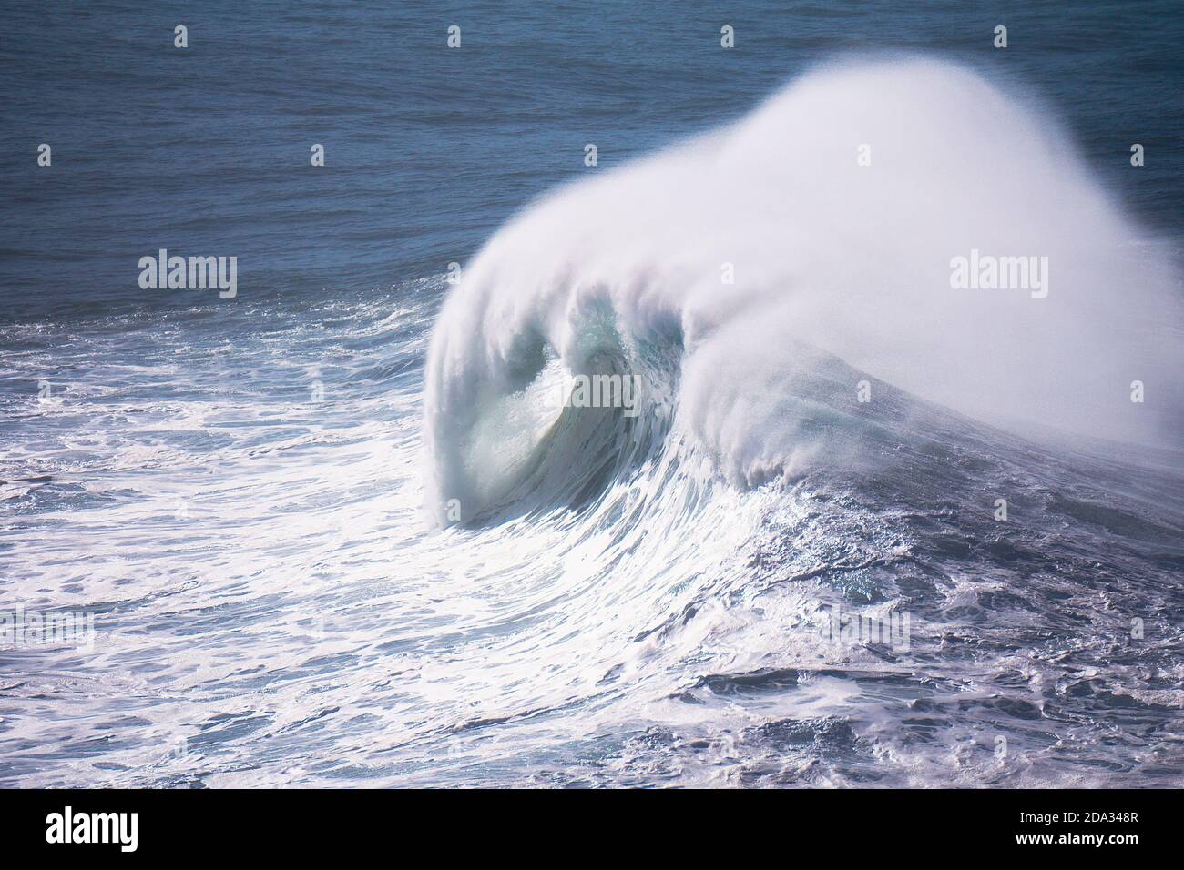 big wave breaking with spray Stock Photo - Alamy