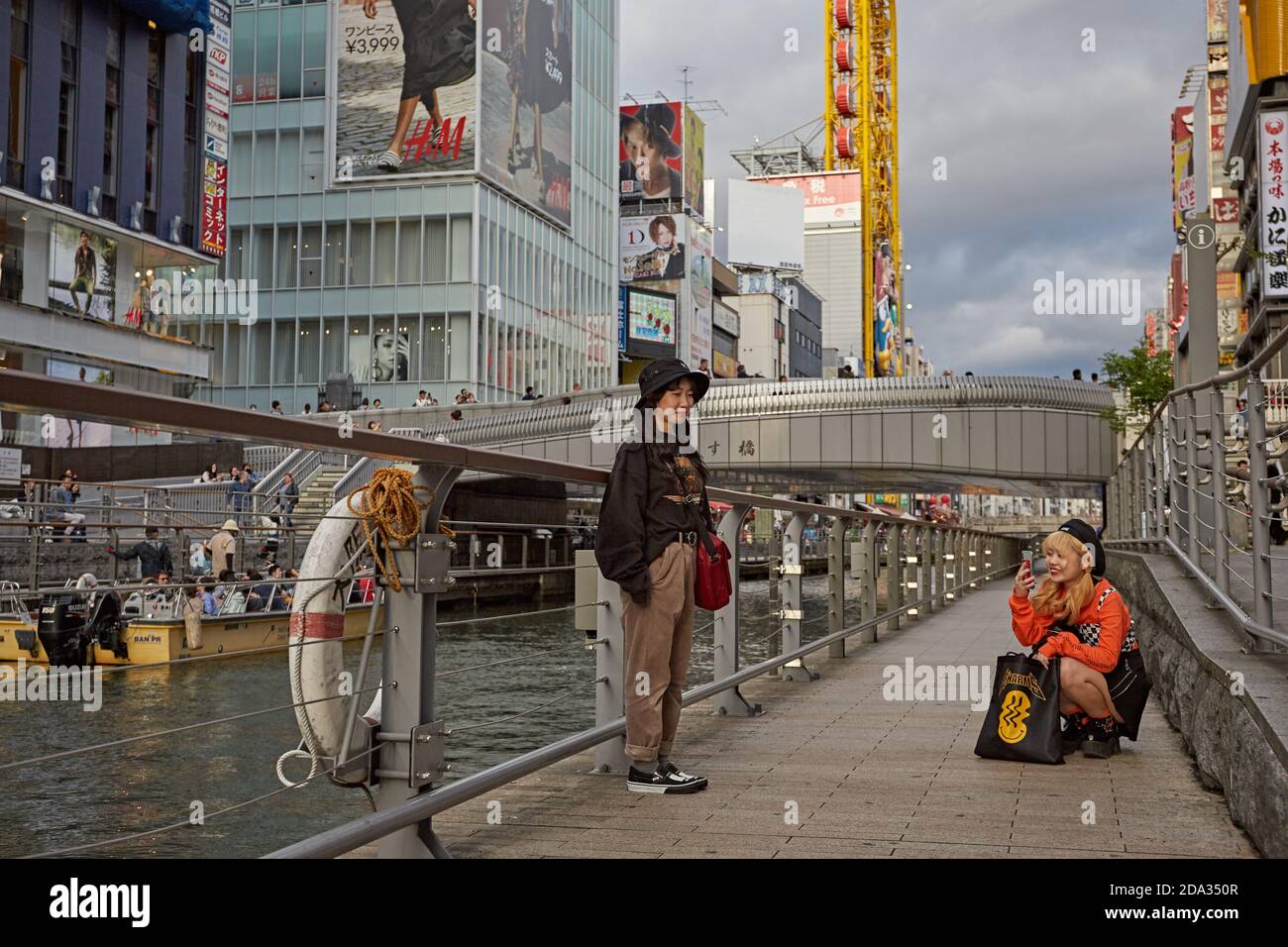 Osaka, Japan, April 2018. Two girls having their picture taken on the ...