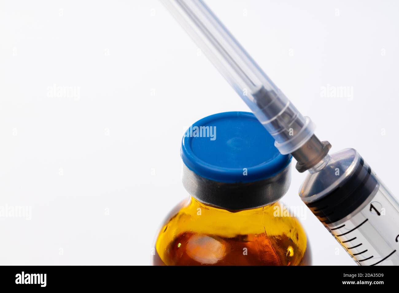 Medical vial with medication and syringe close up Stock Photo - Alamy